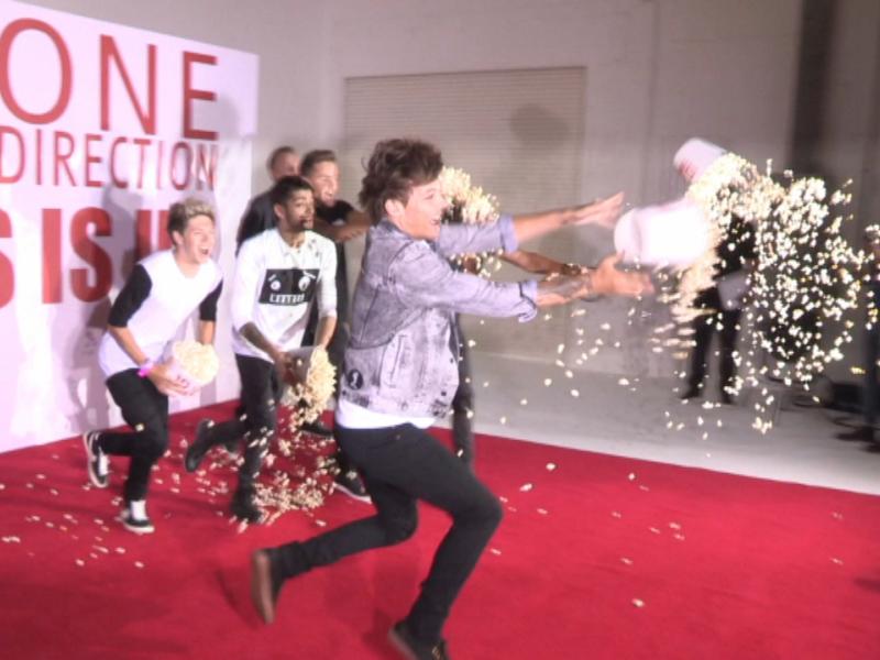 One Direction Promotes Movie, Throws Popcorn on Press - The Hollywood ...