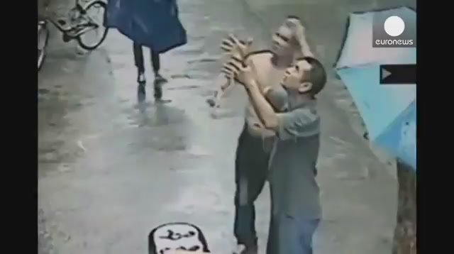 Baby Falls from Second Story Ledge in China, CAUGHT by Two Men: Watch ...